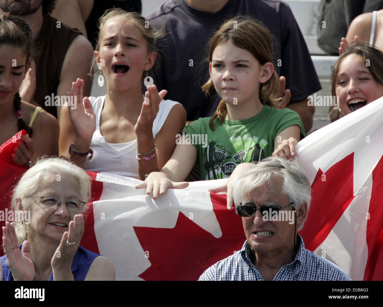 (dpa) - Spectators root for the Canadian diving team with a flag at the ...