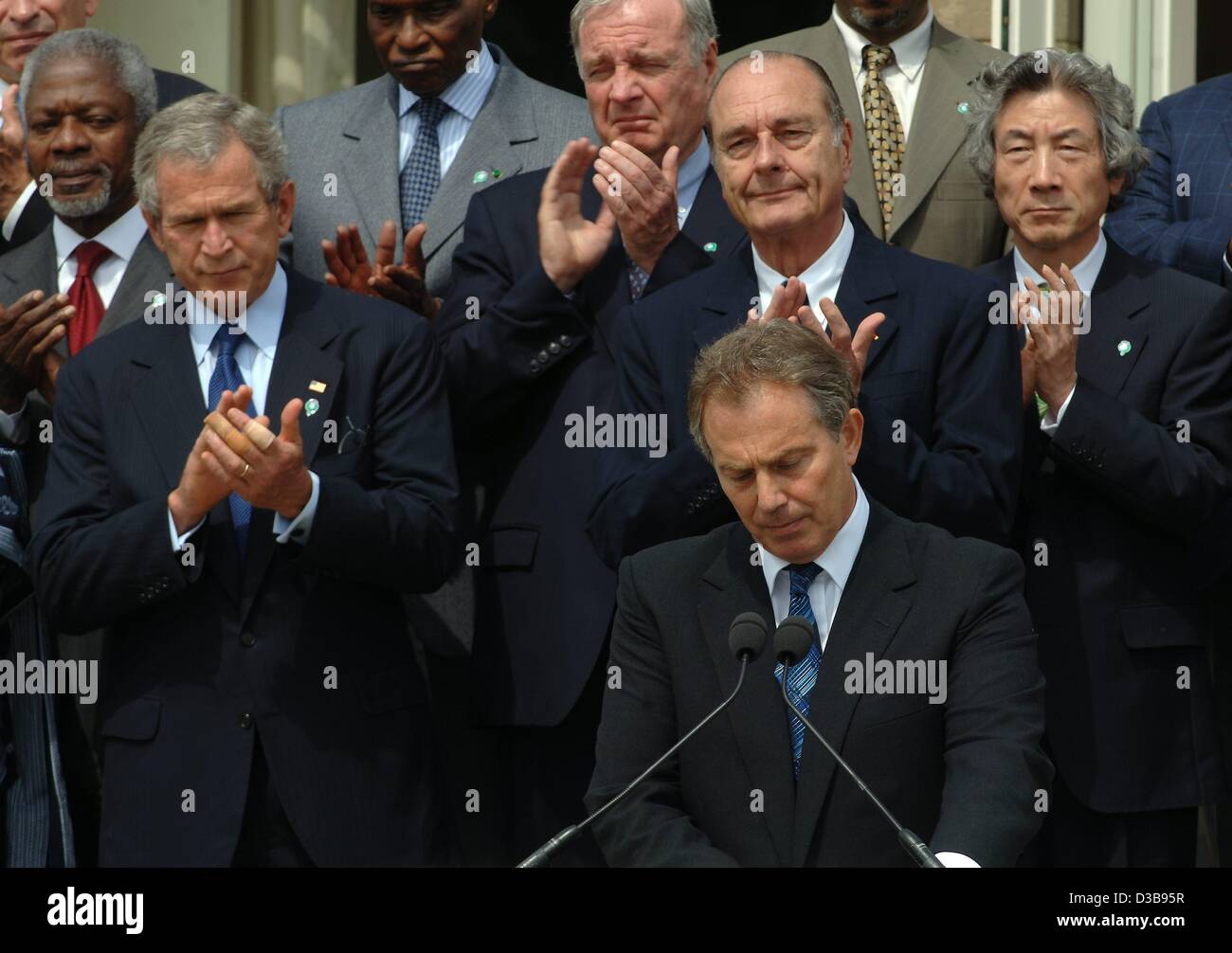 British Prime Minister Tony Blair (front) makes a statement during the ...