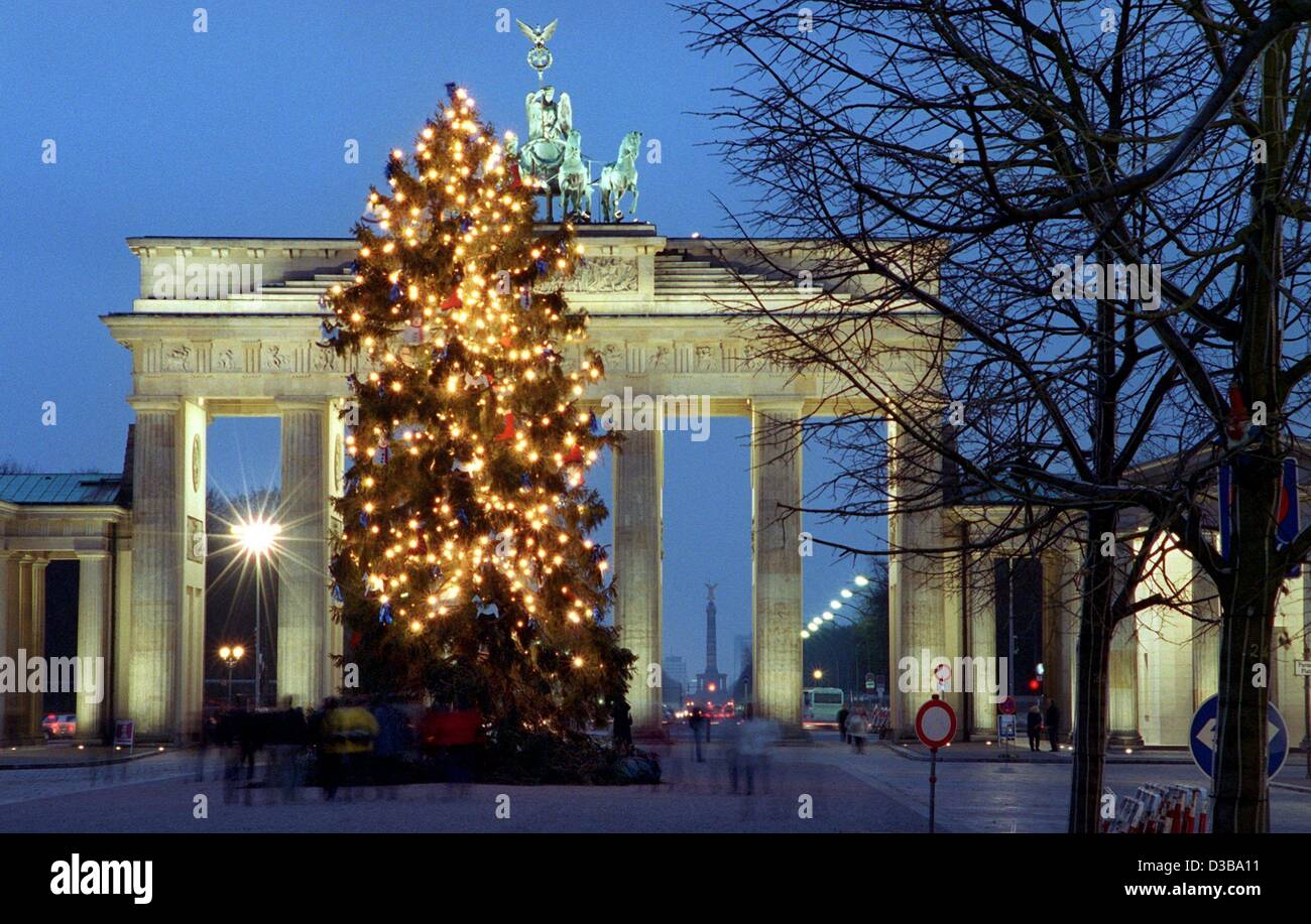 (dpa) - An illuminated Christmas tree shines in front of the newly ...