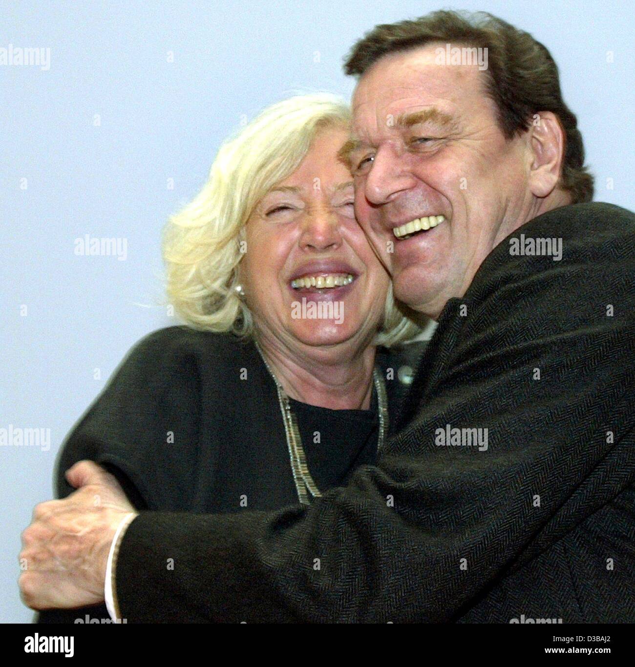 (dpa) - German Chancellor Gerhard Schroeder hugs Renate Schmidt ahead ...