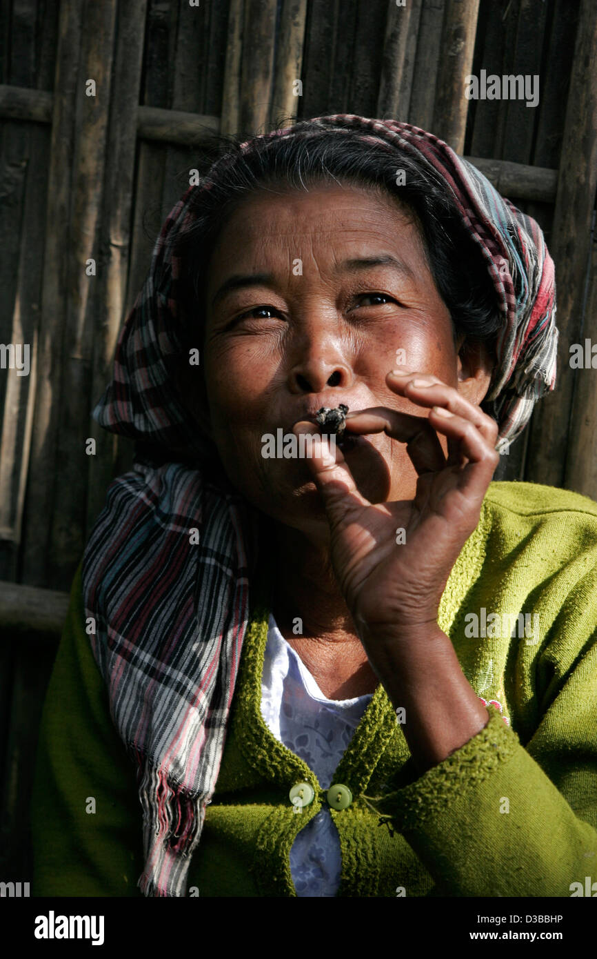 Tribal woman smoking cigar, Rangamati market, Chittagong Hill Tracts ...