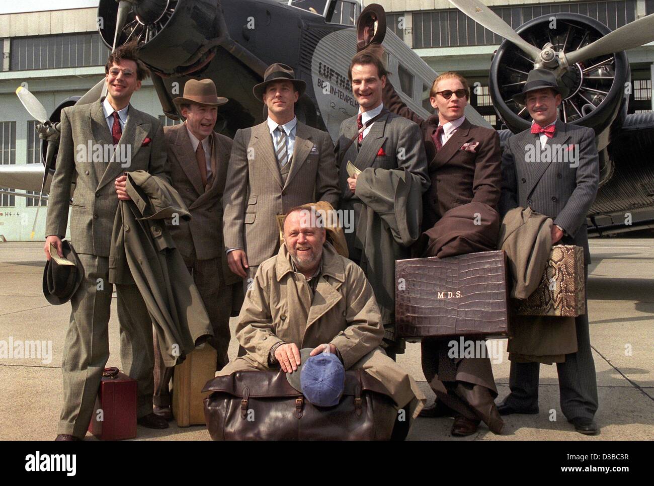 (dpa files) - German film director Joseph Vilsmaier (front) poses with ...