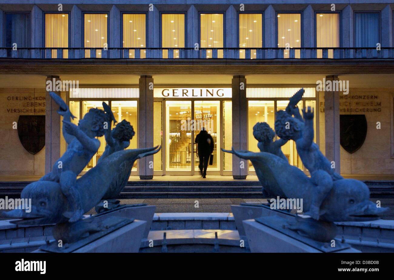 (dpa) - A man enters the headquarter building of the German insurance ...