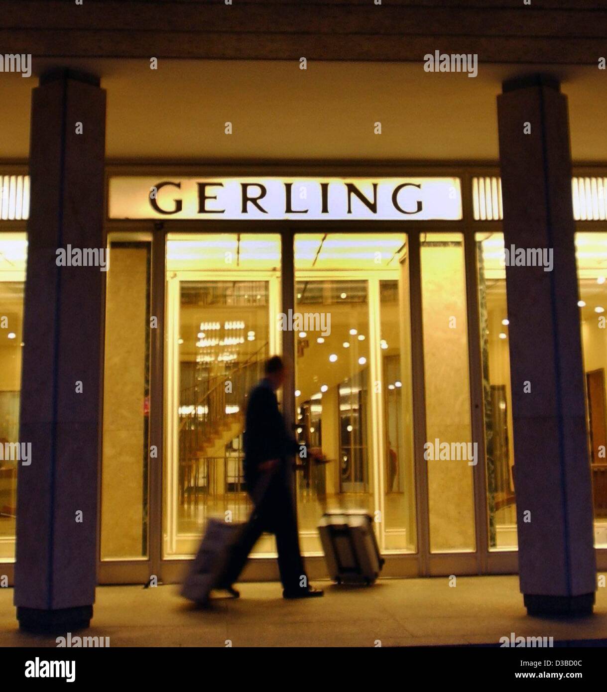 (dpa) - A man enters the headquarter building of the German insurance ...