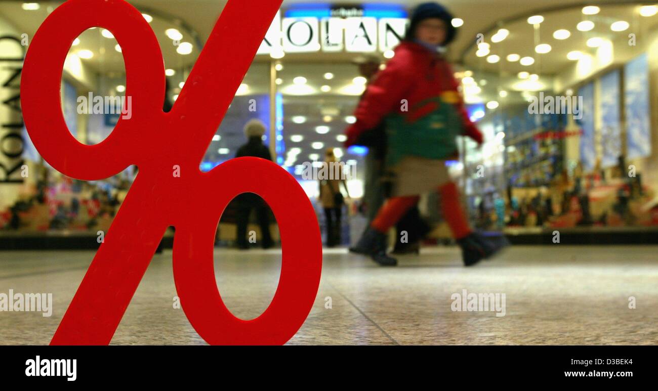 (dpa) - A red per cent sign is glued on a shop window in Magdeburg ...