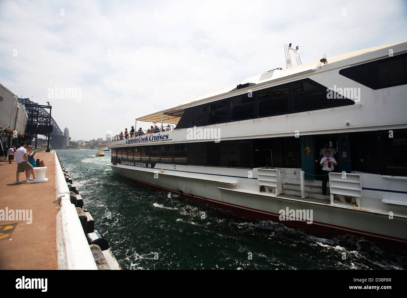 Captain Cook Cruise ferry pulls away from The Rocks in Sydney Harbour ...