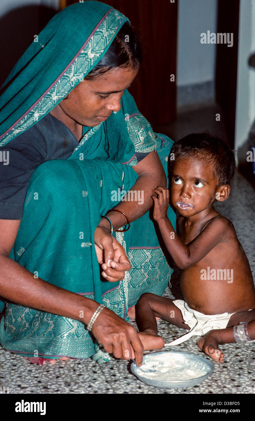 Sitting malnourished hi-res stock photography and images - Alamy