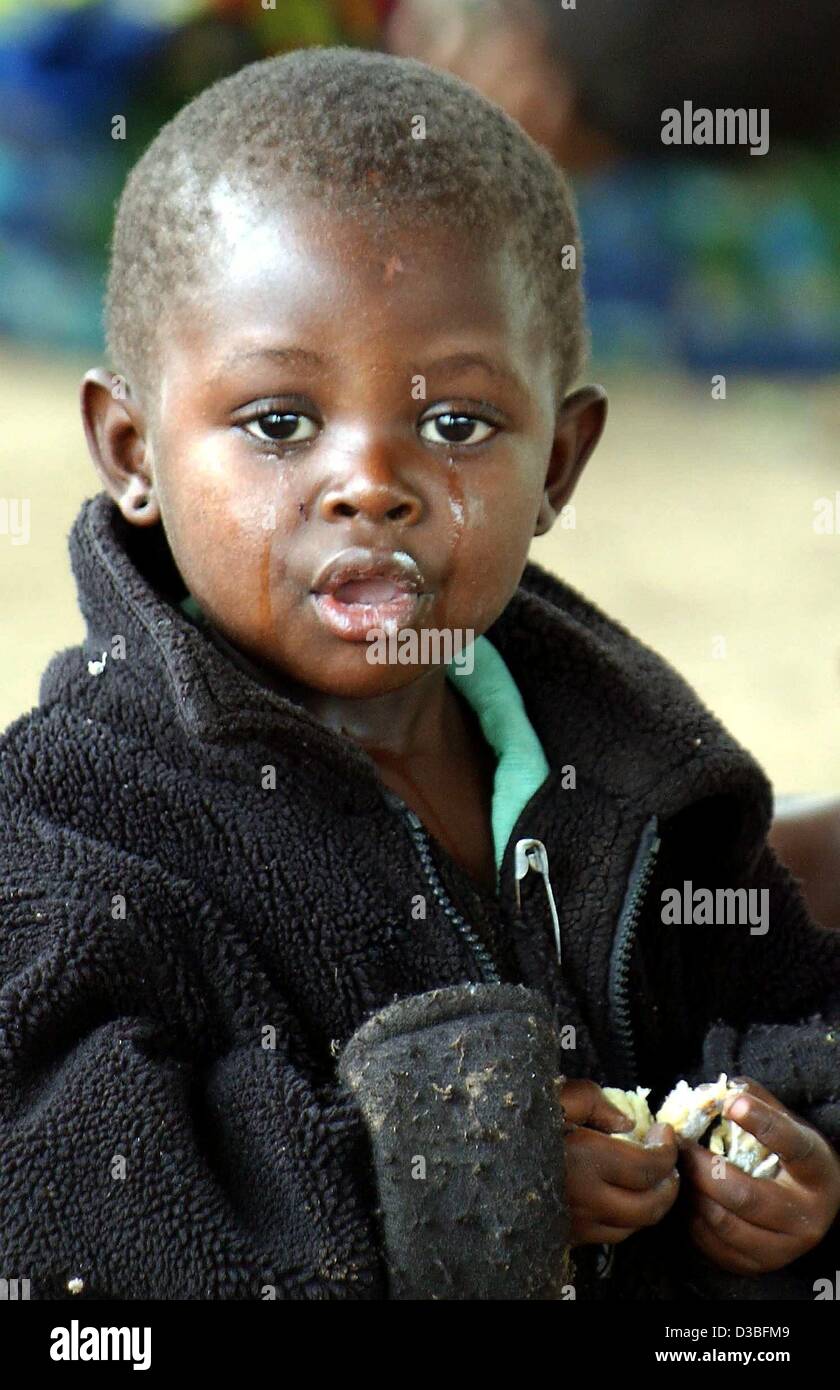 (dpa) - Tears fall down the face of a Congolese boy eating in a refugee ...