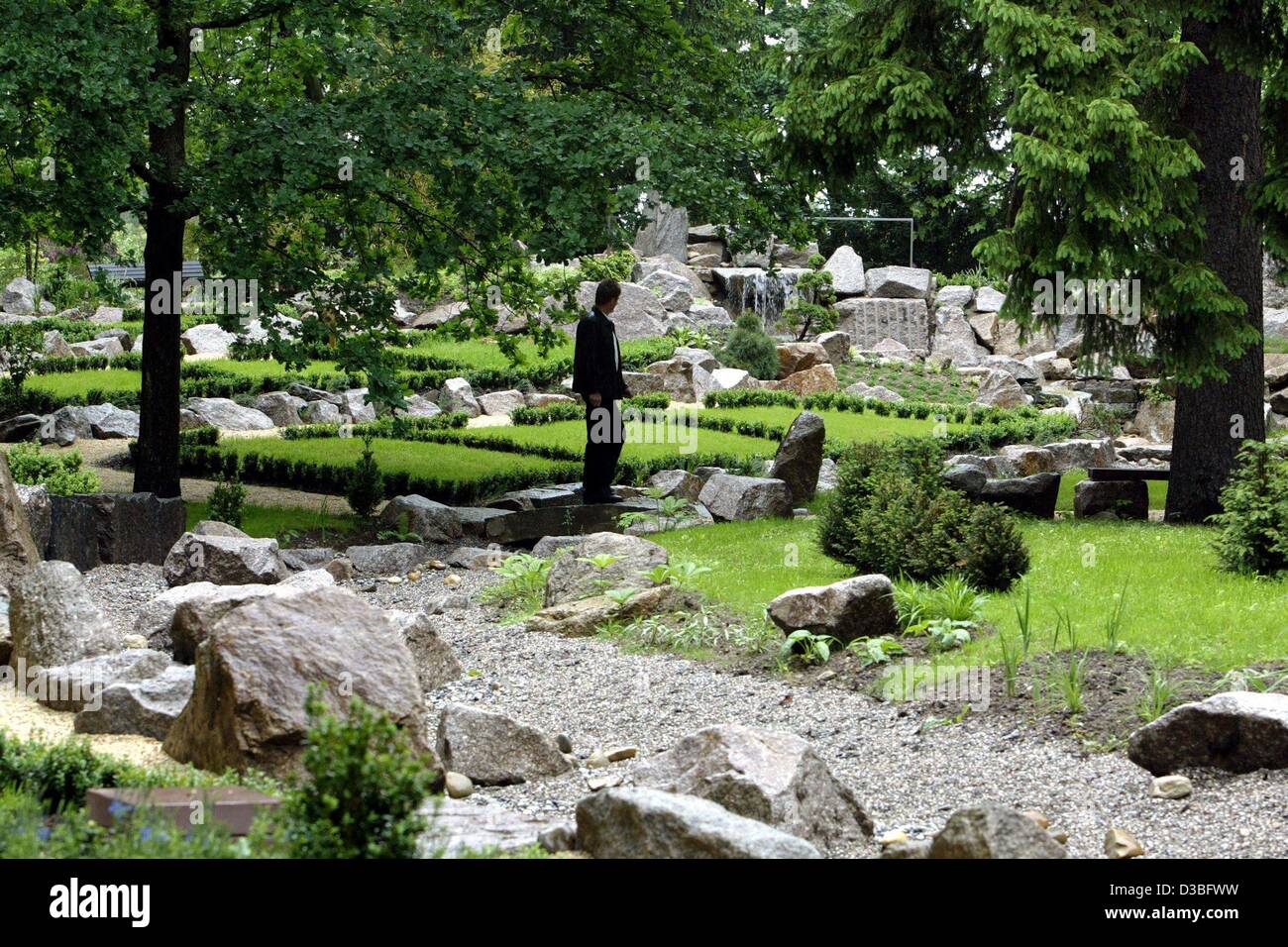 (dpa) - A man walks through a park-alike cemetery for nature-orientated ...