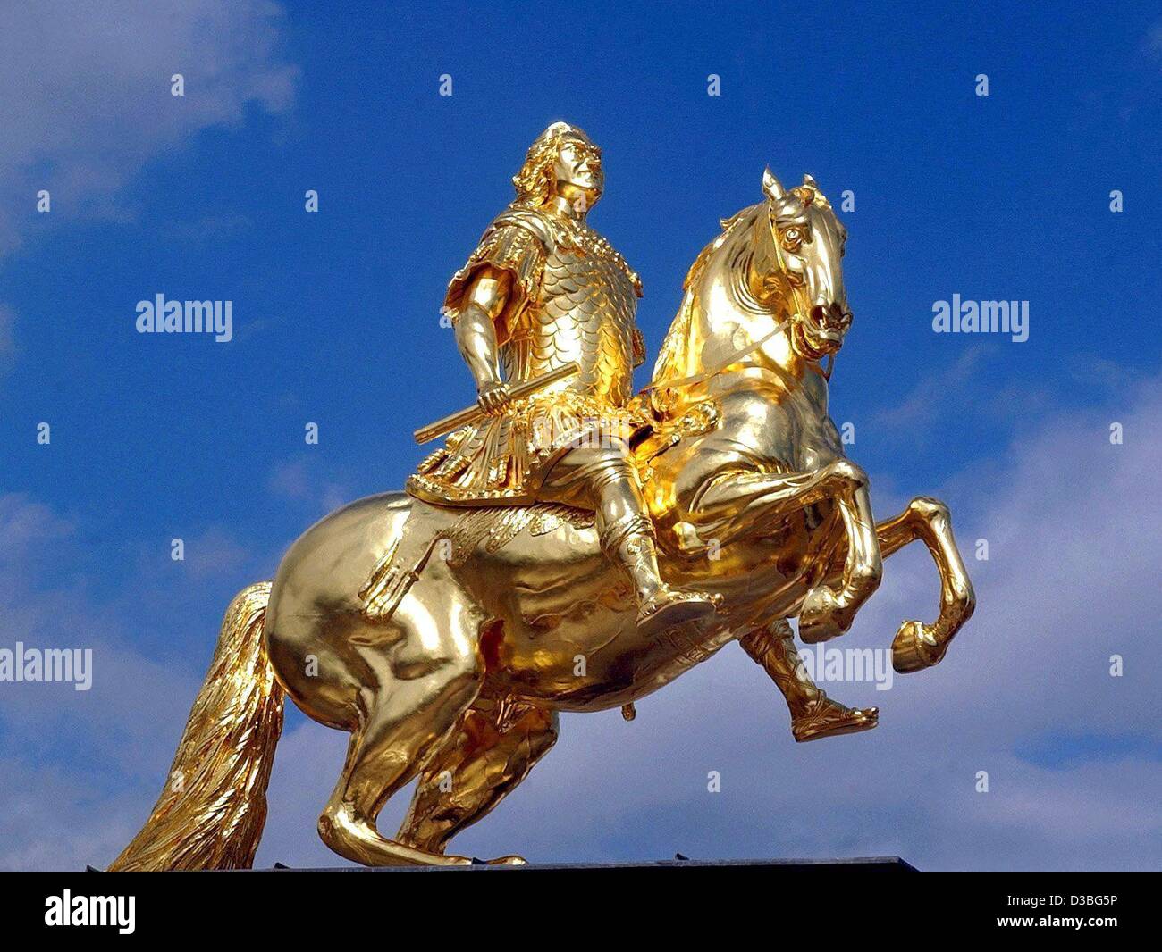 (dpa) - A view of the golden statue of a horseman glaring in the sun in ...