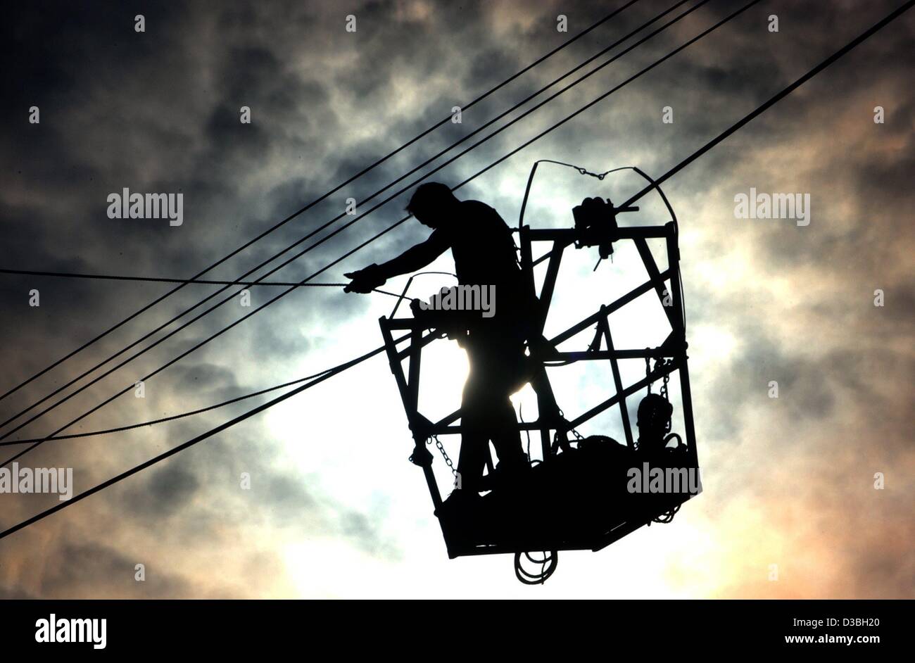 Man working on high voltage power lines hi-res stock photography and ...