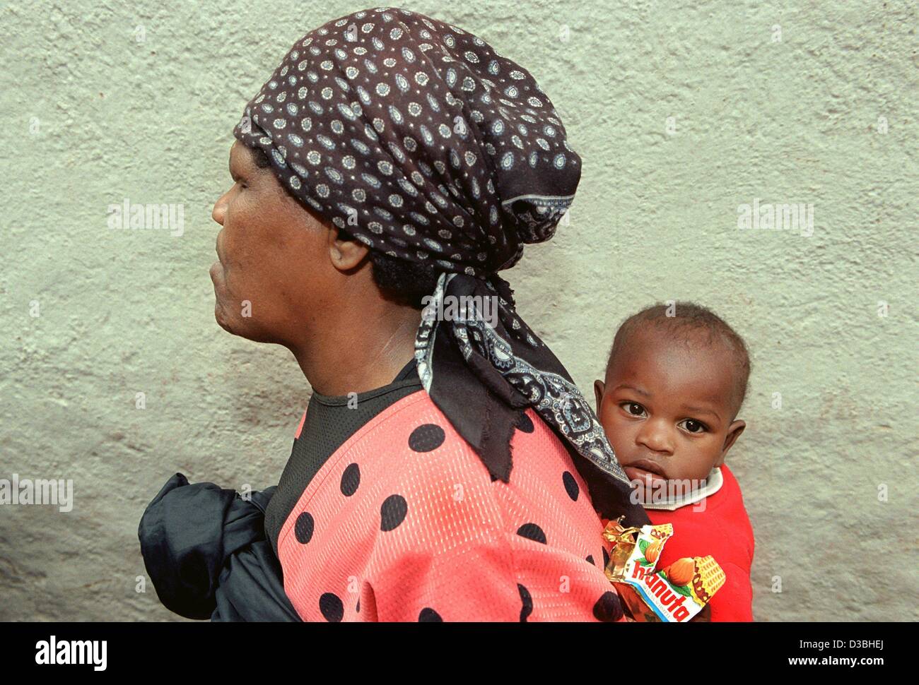 Woman carrying a child on her back hi-res stock photography and images ...