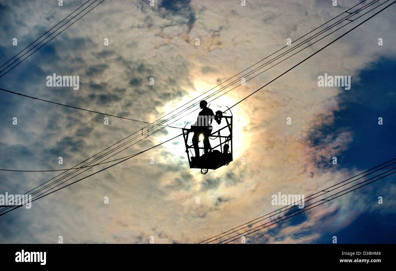 Man working on high voltage power lines hi-res stock photography and ...