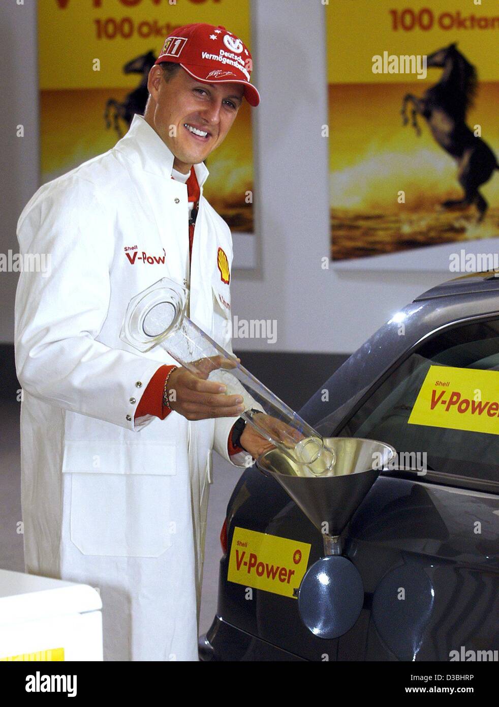 (dpa) - German formula one world champion Michael Schumacher fills a ...