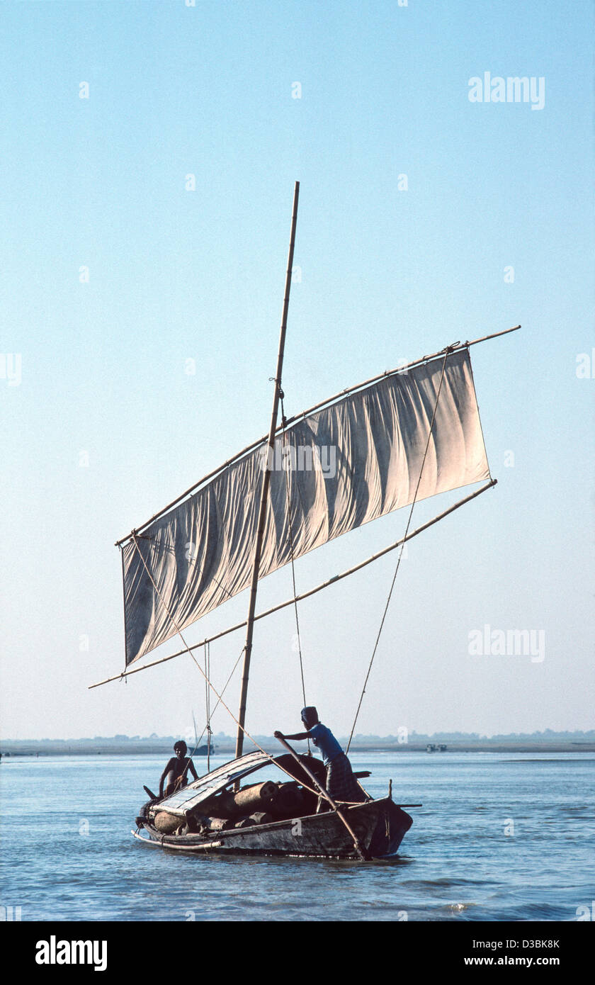 A riverboat under sail carrying hardwood logs from the northern border ...
