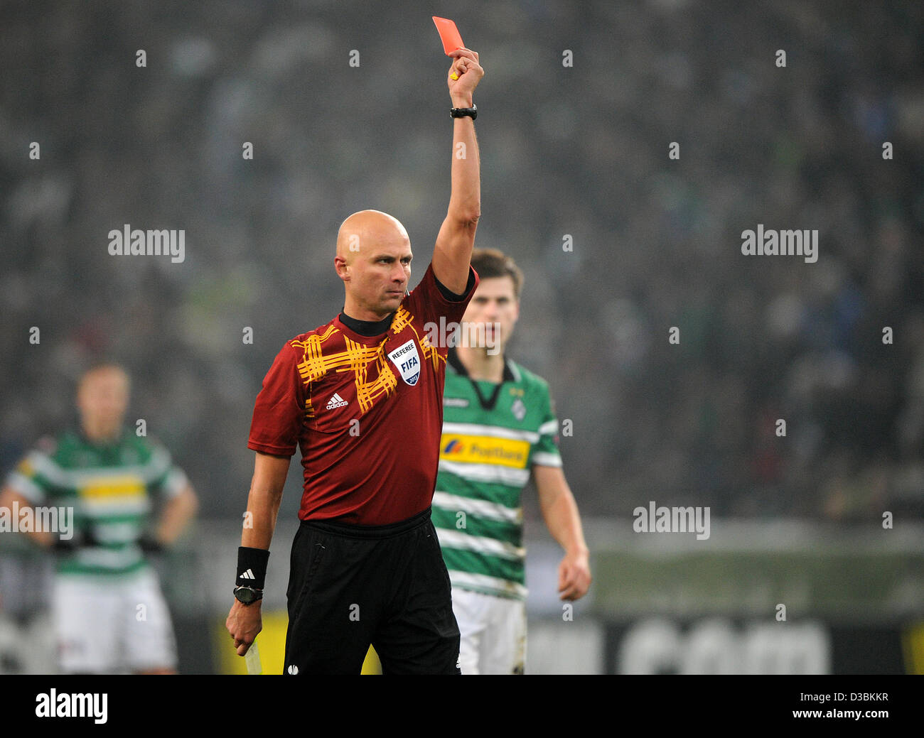 Referee Sergey Karasev from Russia shows the red card during the UEFA ...
