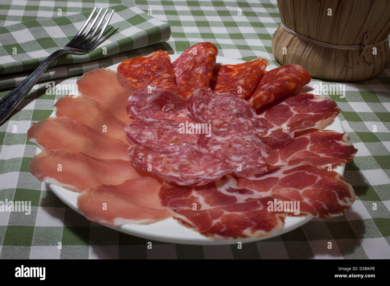 Plate of italian cold meat on a green and withe tablecloth Stock Photo ...