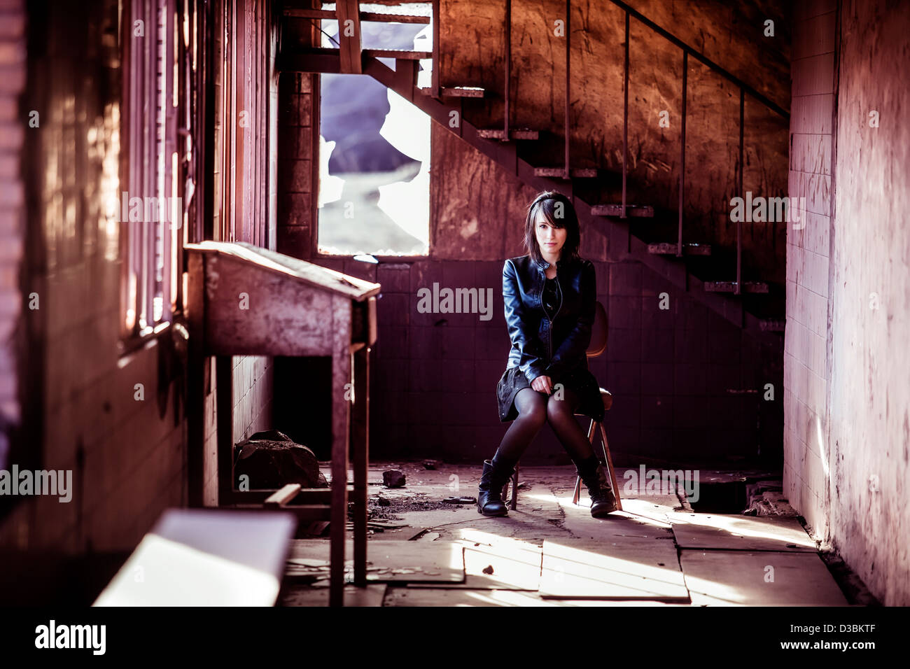 Young beautiful woman inside rusty building Stock Photo - Alamy
