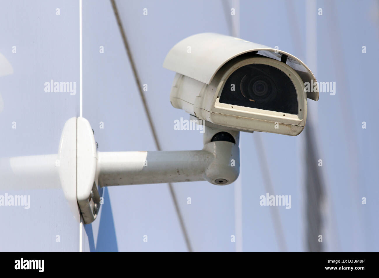 white security cctv camera on the modern facade Stock Photo - Alamy