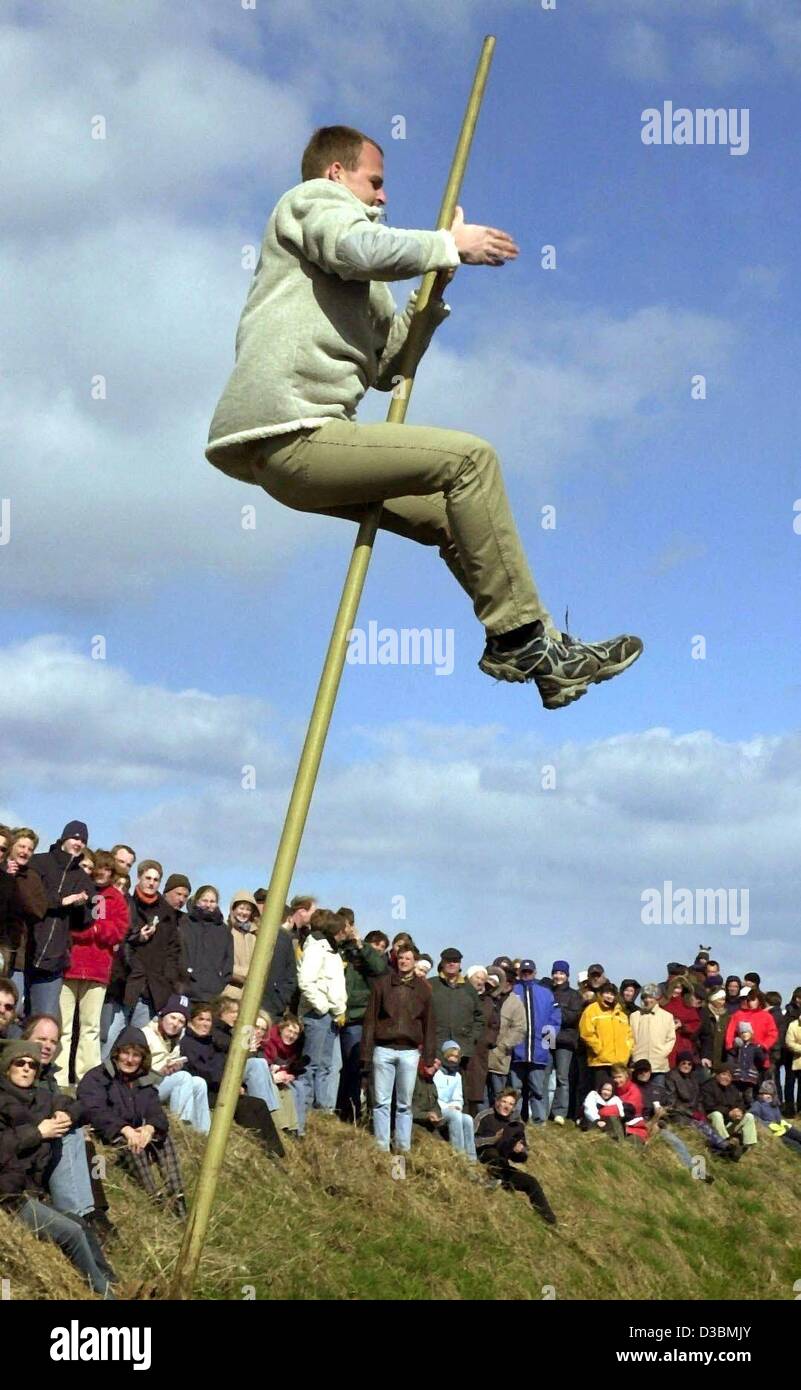 (dpa) - A young man on a 4m long pole vaults across a ditch filled with ...