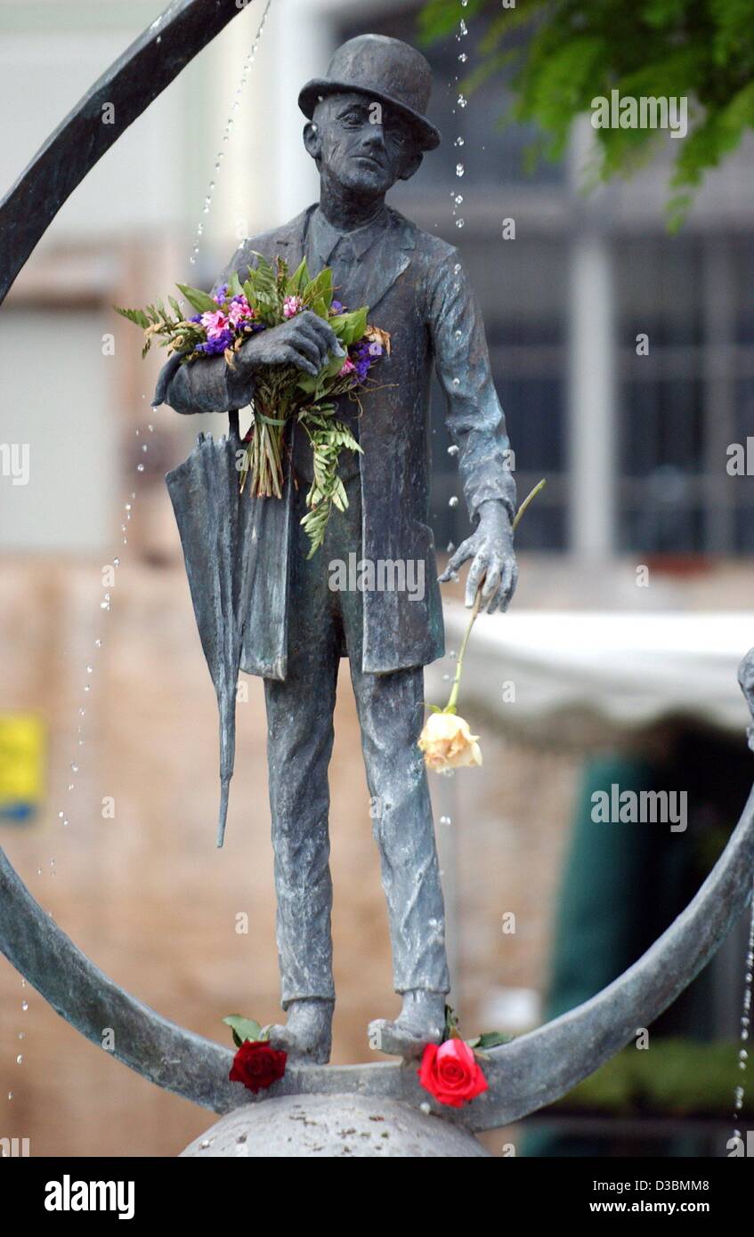 (dpa) - The statue of Karl Valentin is decorated with flowers, at the ...