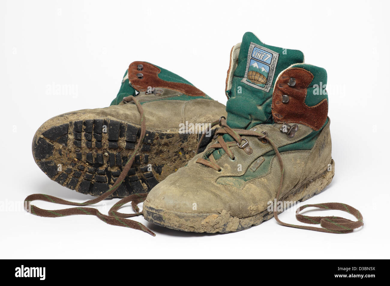 hiking boots covered in mud Stock Photo - Alamy