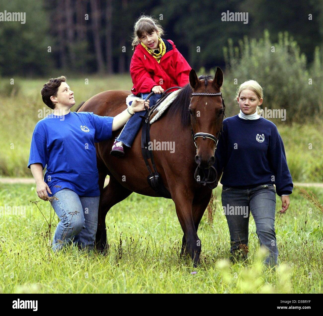 Disabled child riding horse hi-res stock photography and images - Alamy