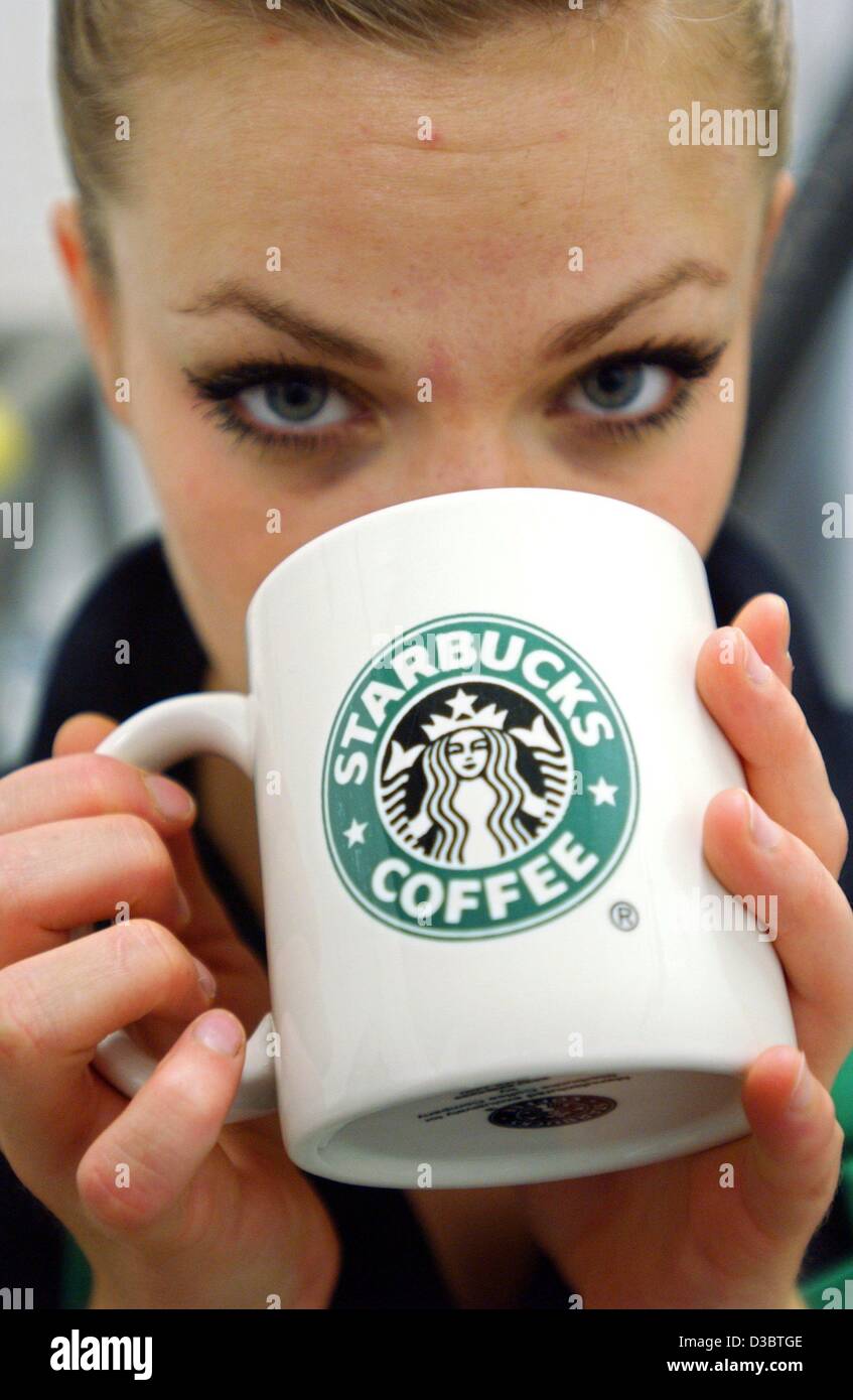 (dpa) - An employee drinks a coffee in a cafe of the Starbucks Coffee ...