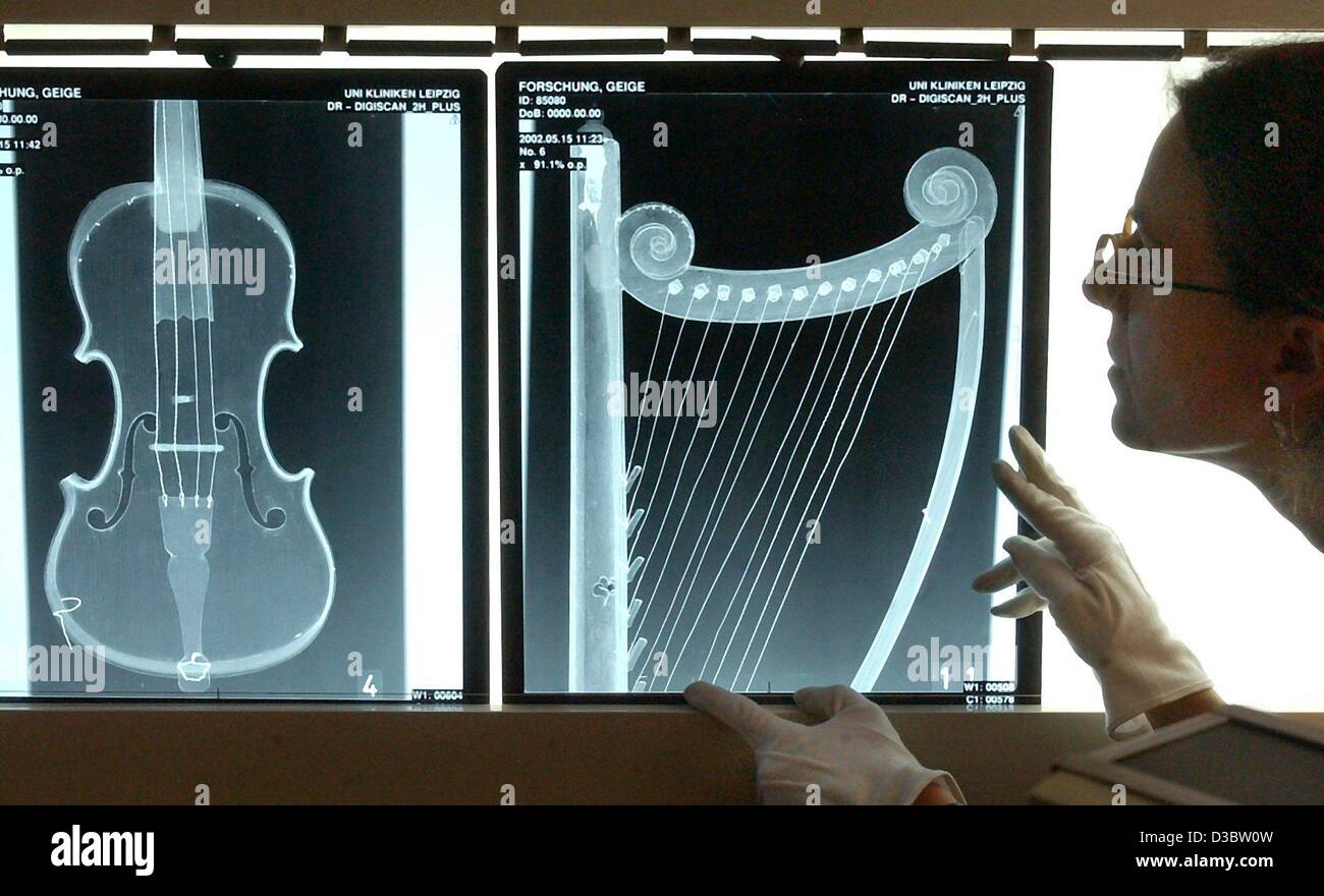 (dpa) - Ute Singer, a techincal illustrator, exmines the computer ...