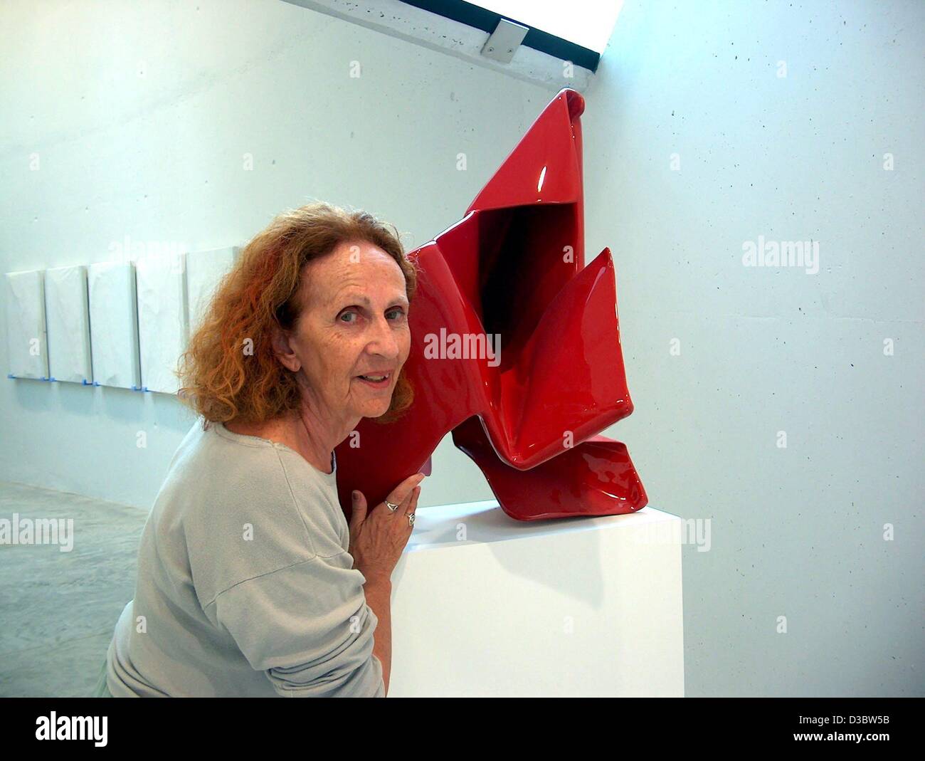 (dpa) - US artist Barbara Weil poses next to a red sculpture in the new ...