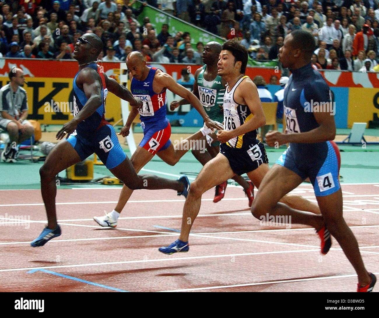 (dpa) - US sprinter John Capel is the first to cross the finish line ...