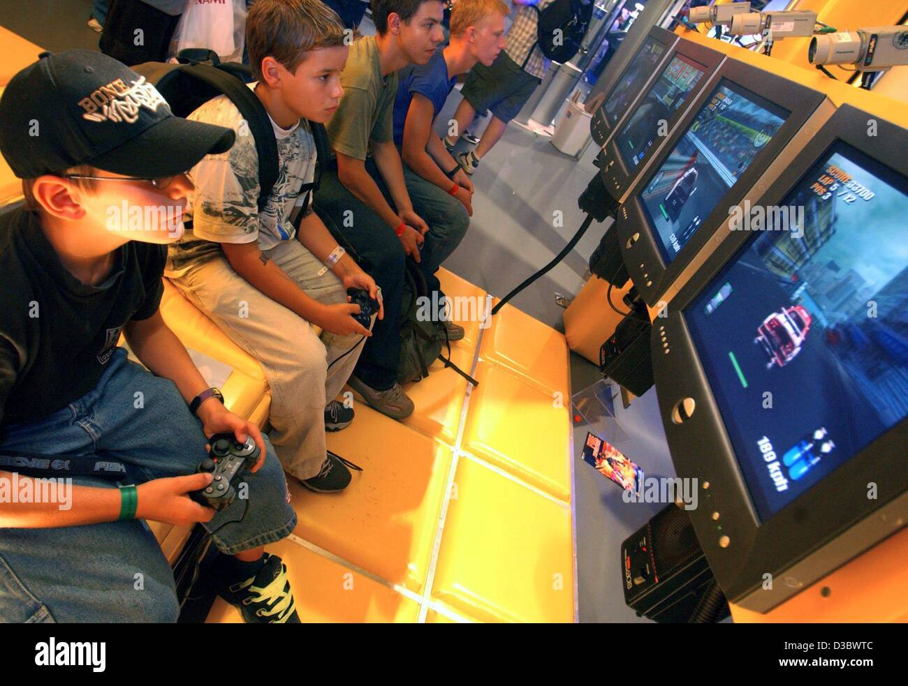 (dpa) - Young people play computer games at the Sony stand during the ...
