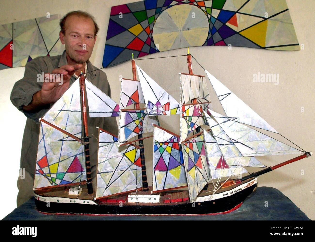 (dpa) - The painter Klaus Boellhoff shows the model of the sailing ship ...