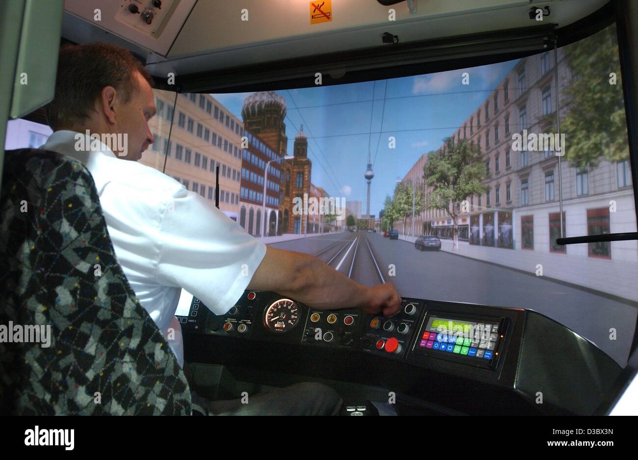 (dpa) - Streetcar driver Thomas Klinder sits in a traffic simulator ...