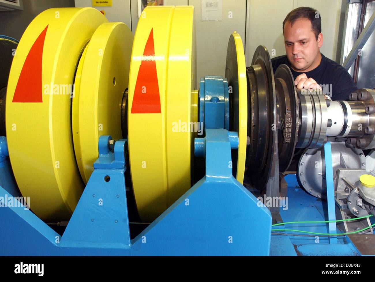 (dpa) - Employee Michael Posselt adjusts the test brakes of flywheel ...