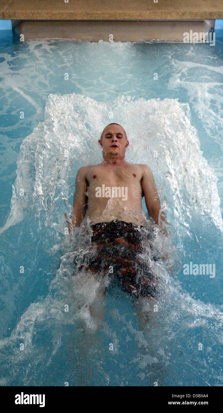 (dpa) - A patient swims on his back on the artificial stream in a ...