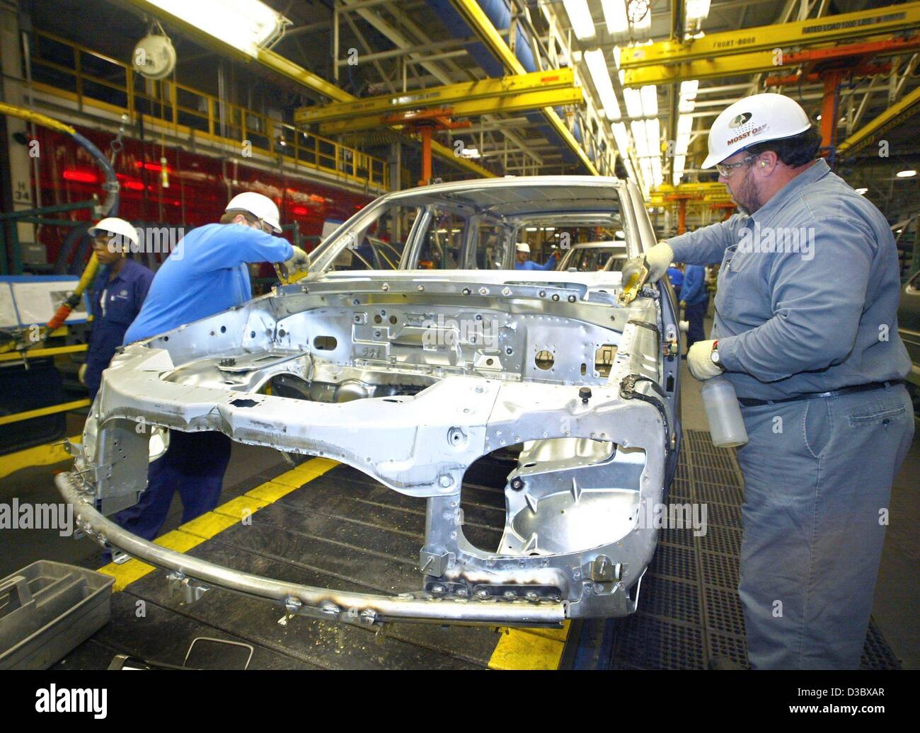People Working In A Car Factory