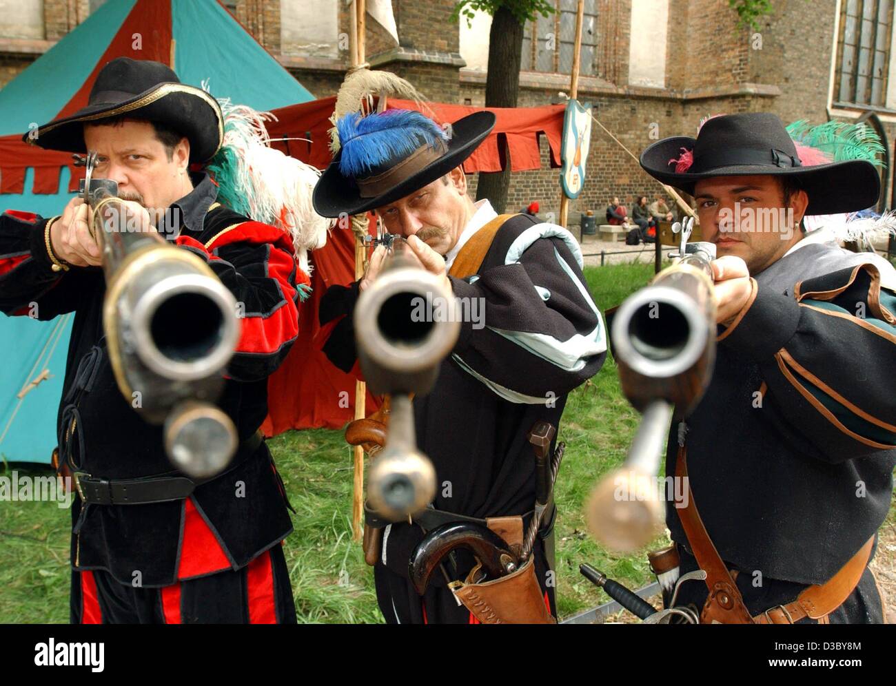 (dpa) - Three musketeers have their finger on the trigger of their ...