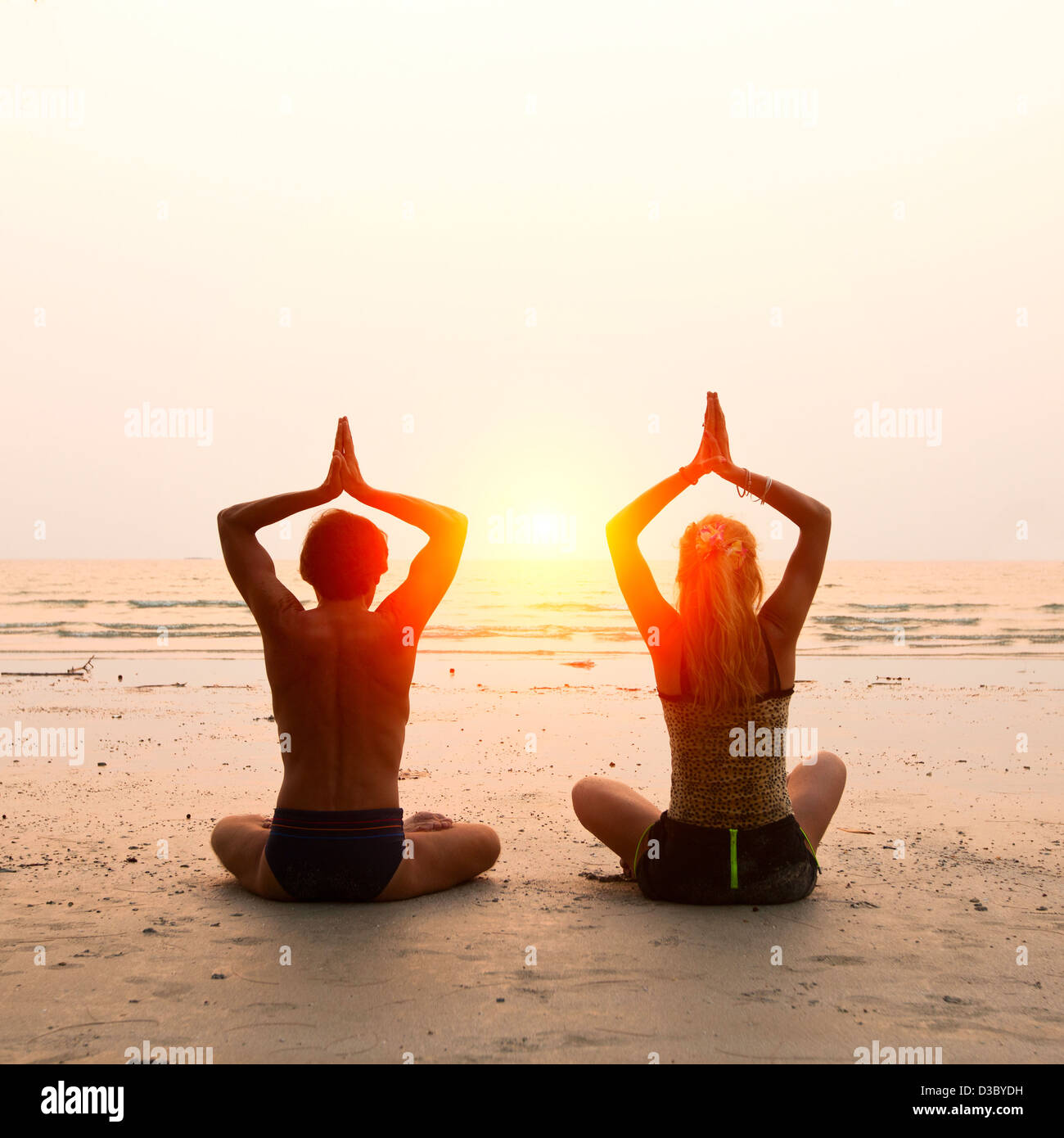 Couple sitting in lotus position hi-res stock photography and images ...