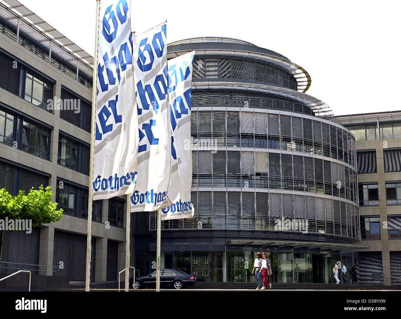 (dpa) - Flags with the company logo flap in front of the headquarters ...