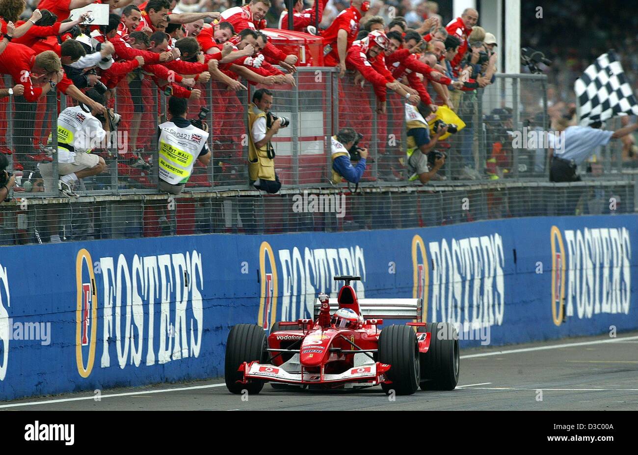 (dpa) - Brazilian formula one pilot Rubens Barrichello (Ferrari) cheers ...
