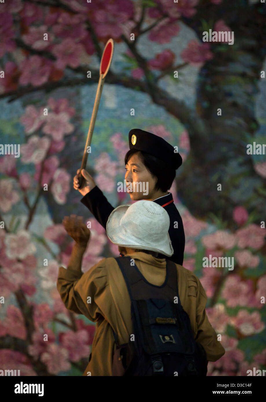 A Woman Guard Signals As A Train Arrives In The Subway, Pyongyang ...