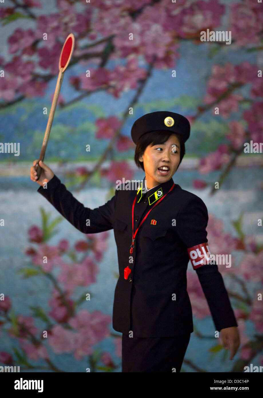 A Woman Guard Signals As A Train Arrives In The Subway, Pyongyang ...