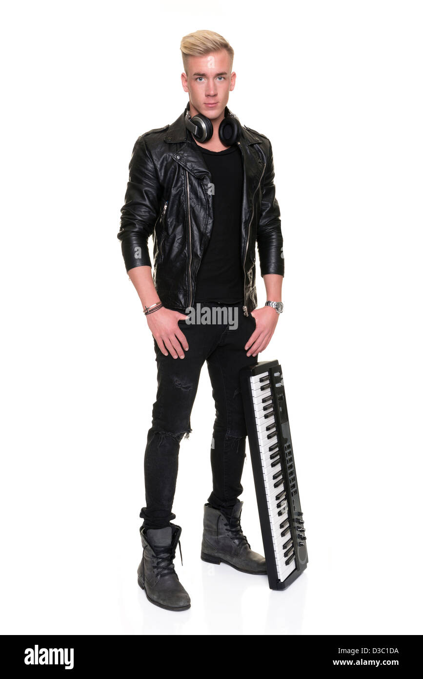 Young person (dj) standing in the studio in front of white background ...