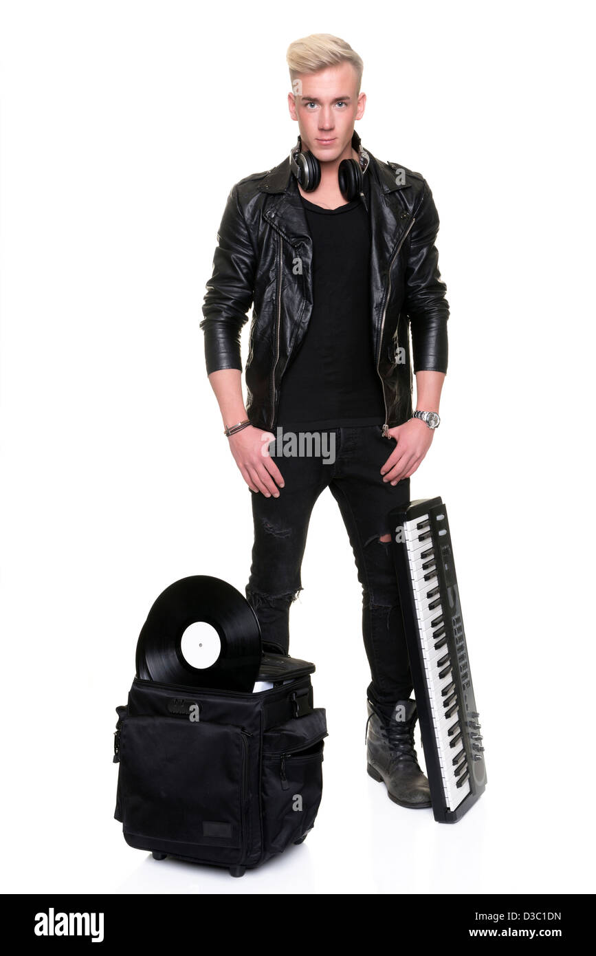 Young person (dj) standing in the studio in front of white background ...