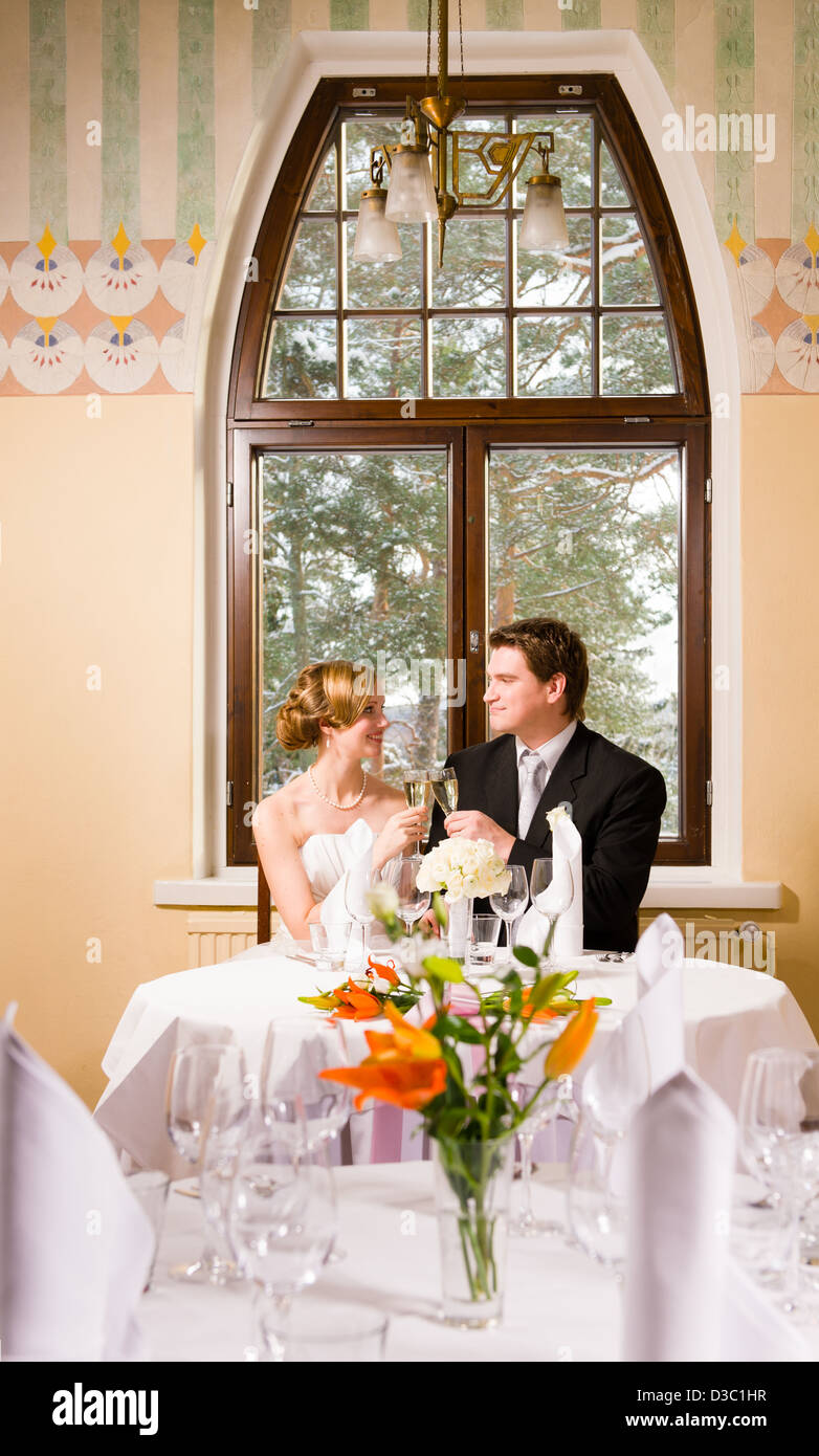Happy couple doing a toast in the restaurant Stock Photo - Alamy
