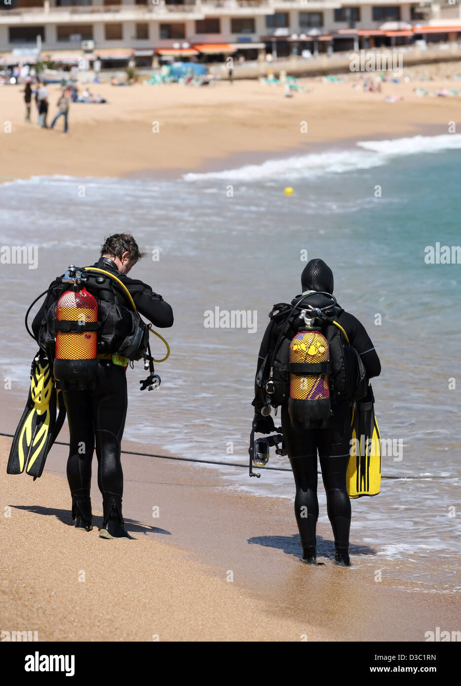 Two frogmens with aqualungs on a coast of the mediterranean sea. Spain ...