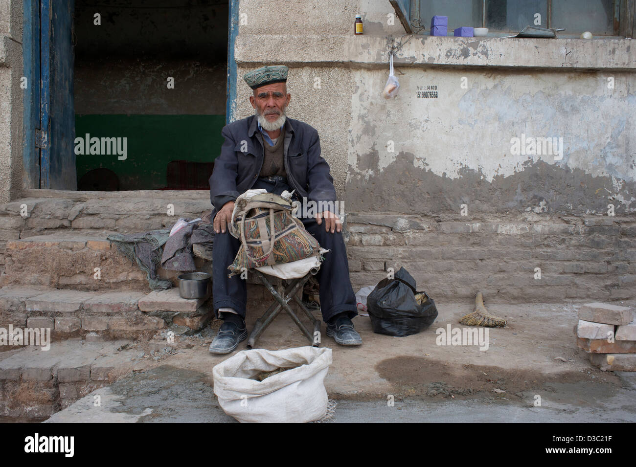 Poor old man sitting in hi-res stock photography and images - Alamy