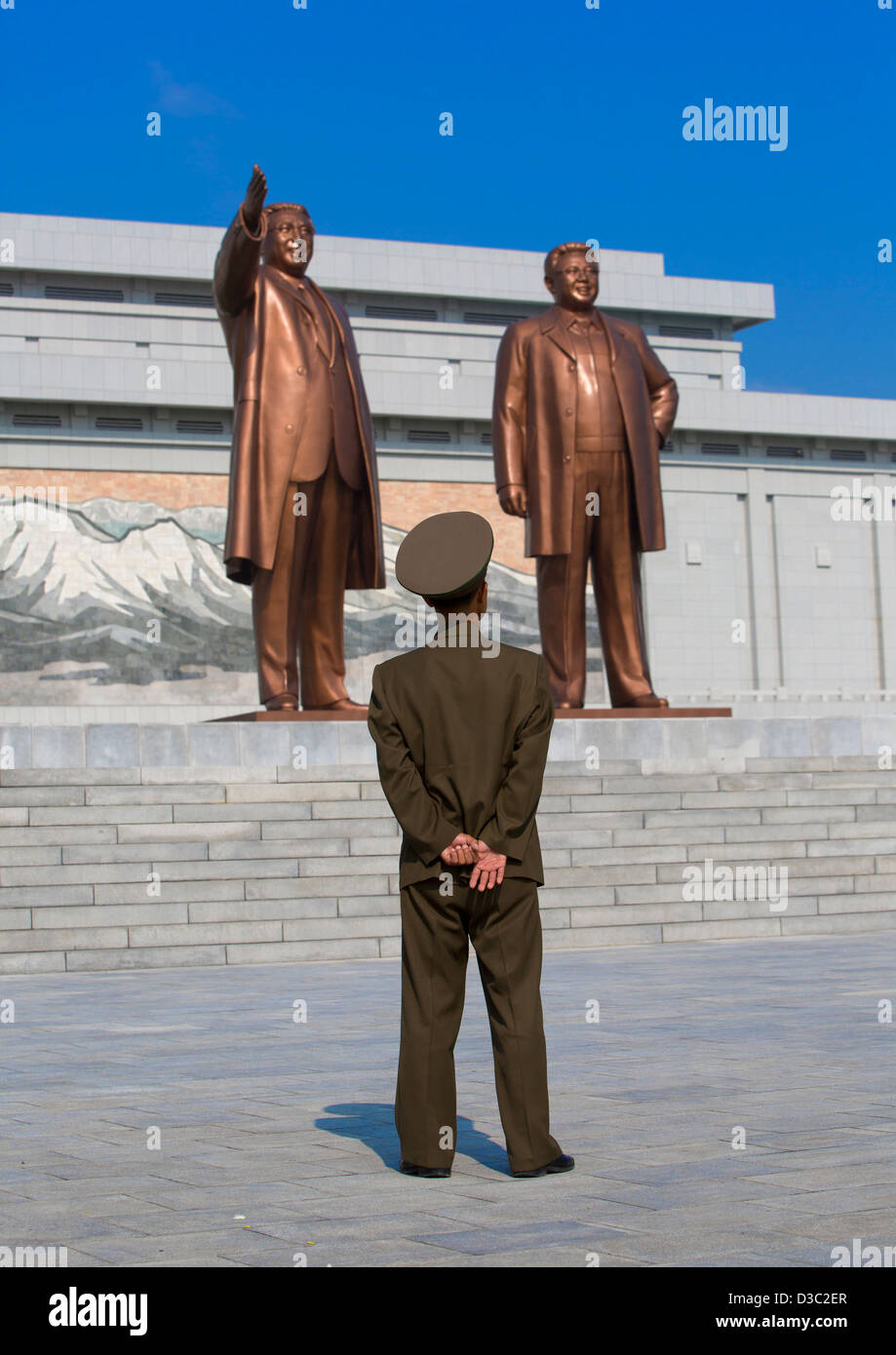 Soldier Paying Respect To The Two Statues Of The Dear Leaders In Grand ...