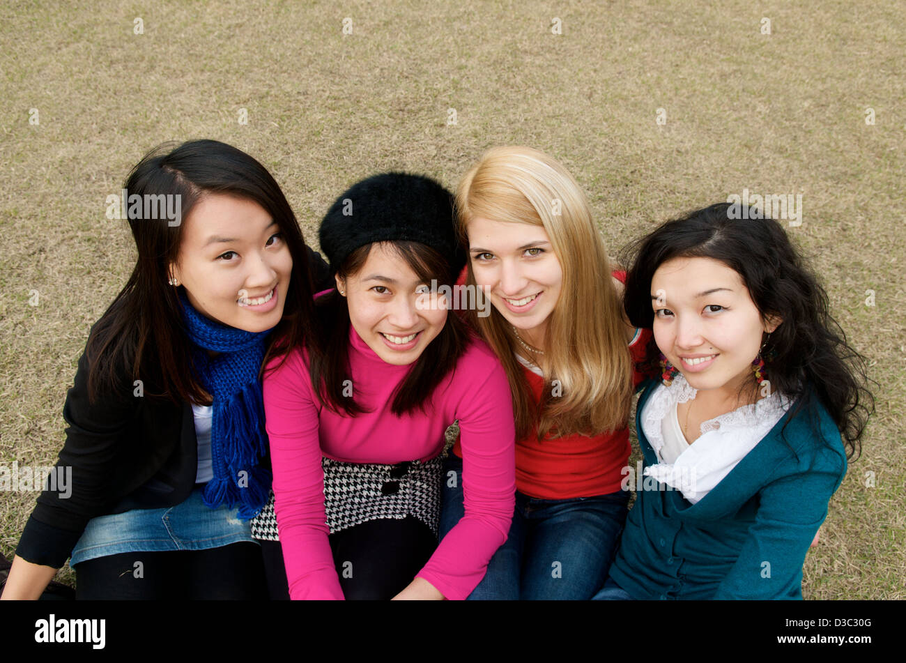 Group of 4 female students outdoor from above Stock Photo - Alamy